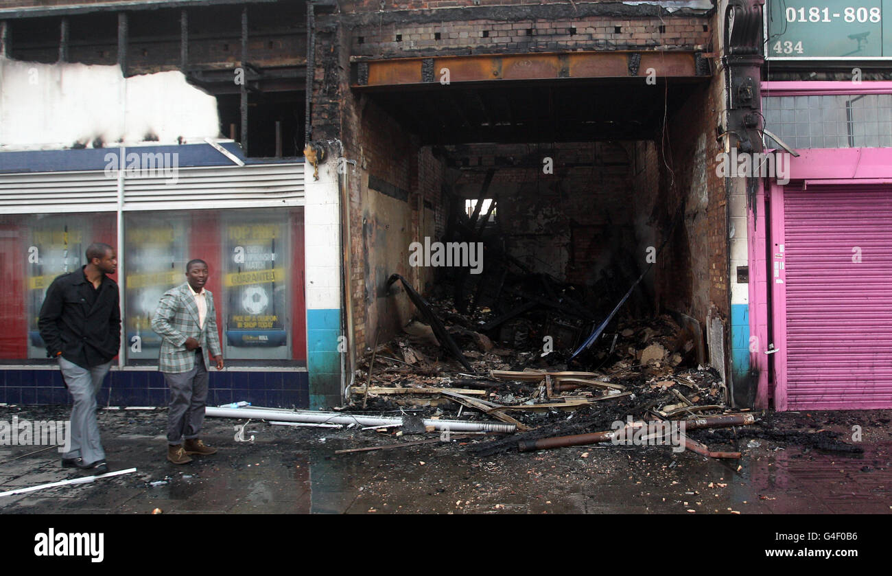 A general view of a burned out shop in Tottenham, north London as ...