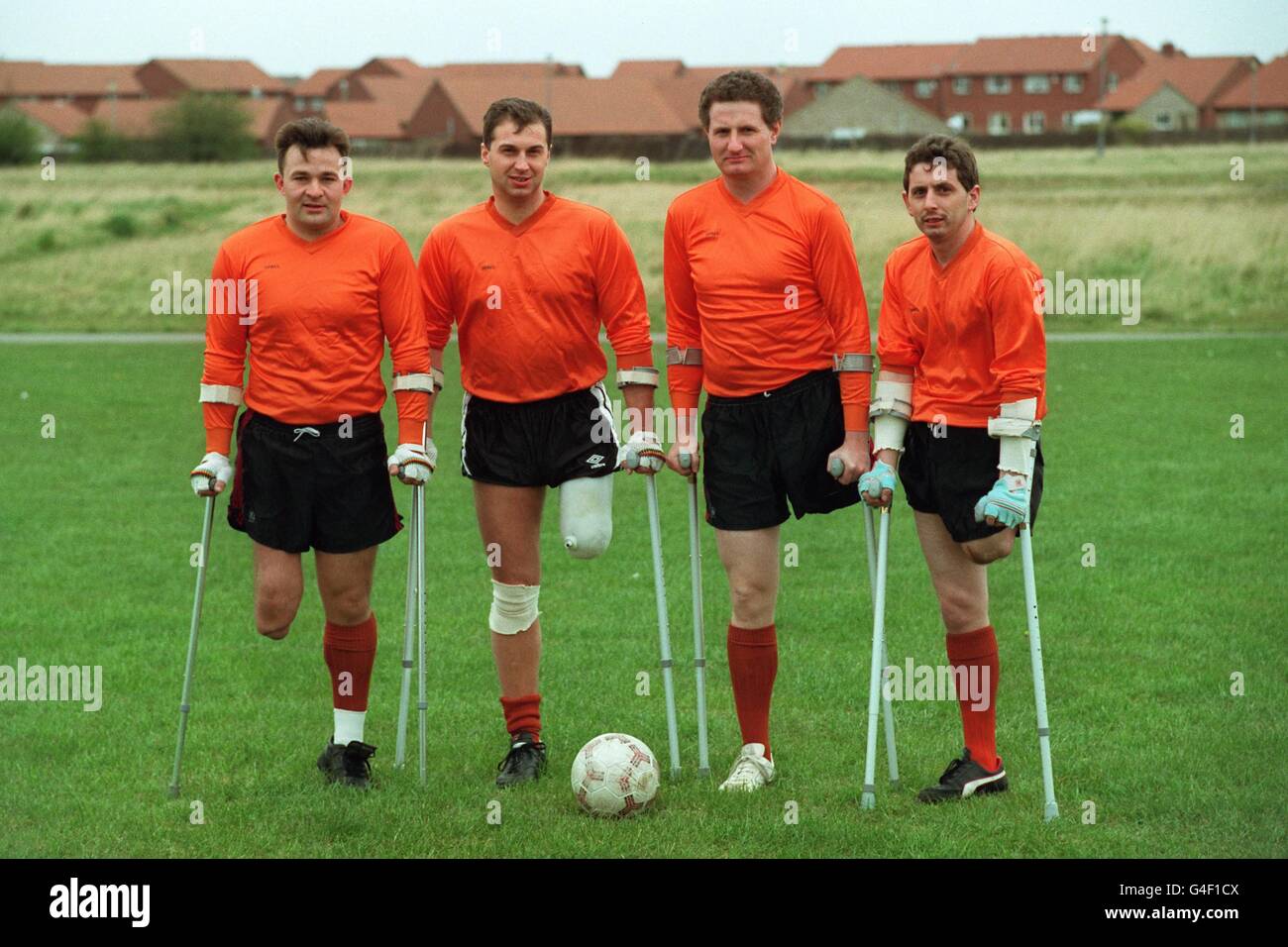 Soccer - One Legged Team. Four members of the one legged team in ...