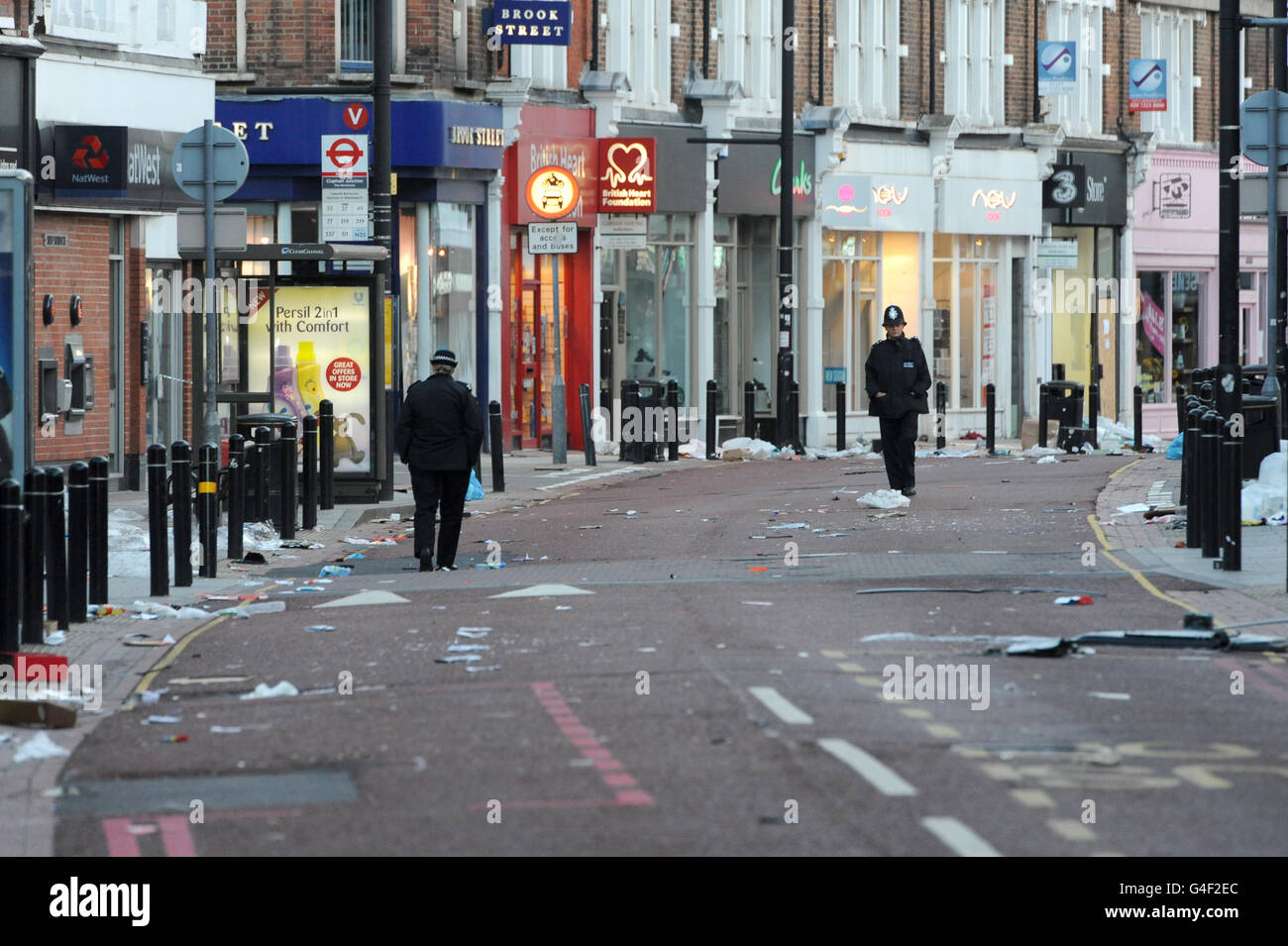Police officers survey the damage on St John's Road, Clapham Junction ...