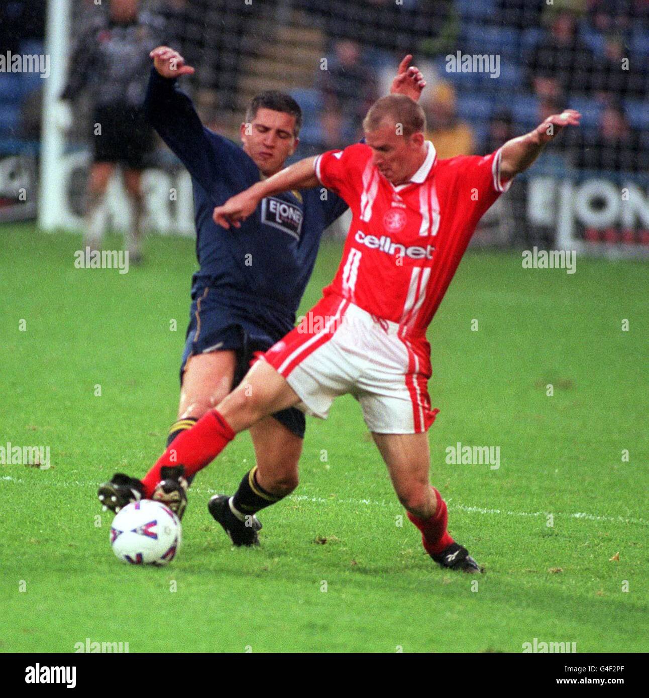 Wimbledon's Andy Roberts (left) tackles Middlesborough's Robbie Mustoe ...