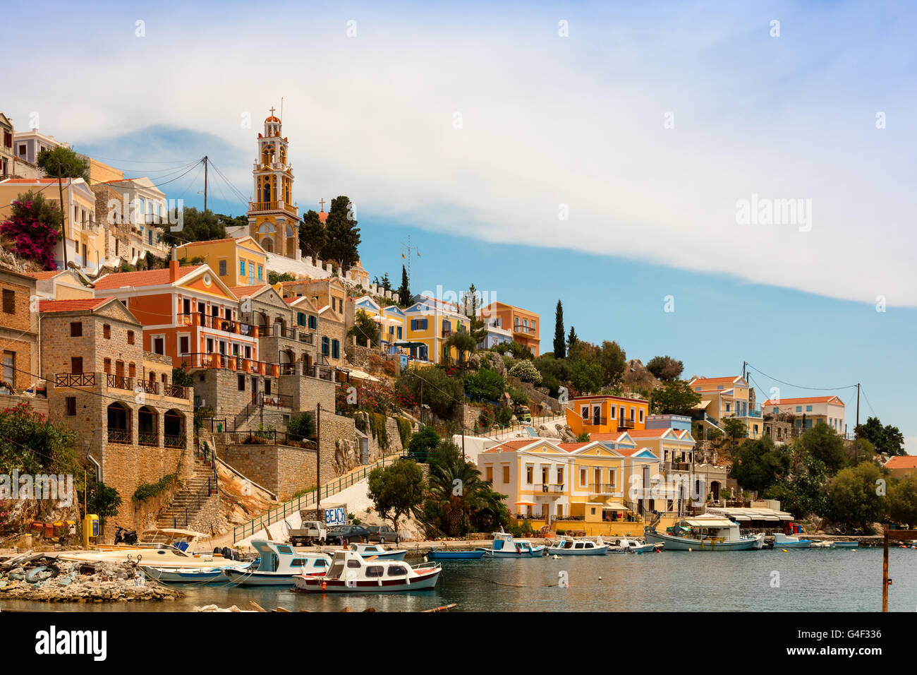 Neo-Classical houses in picturesque harbor on the island of Symi in ...