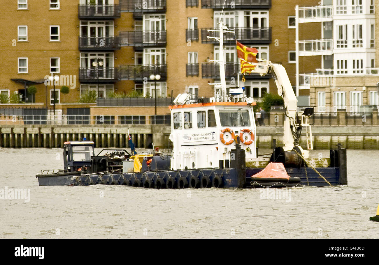 A crane and life raft sit above a tug which sank this morning on the ...