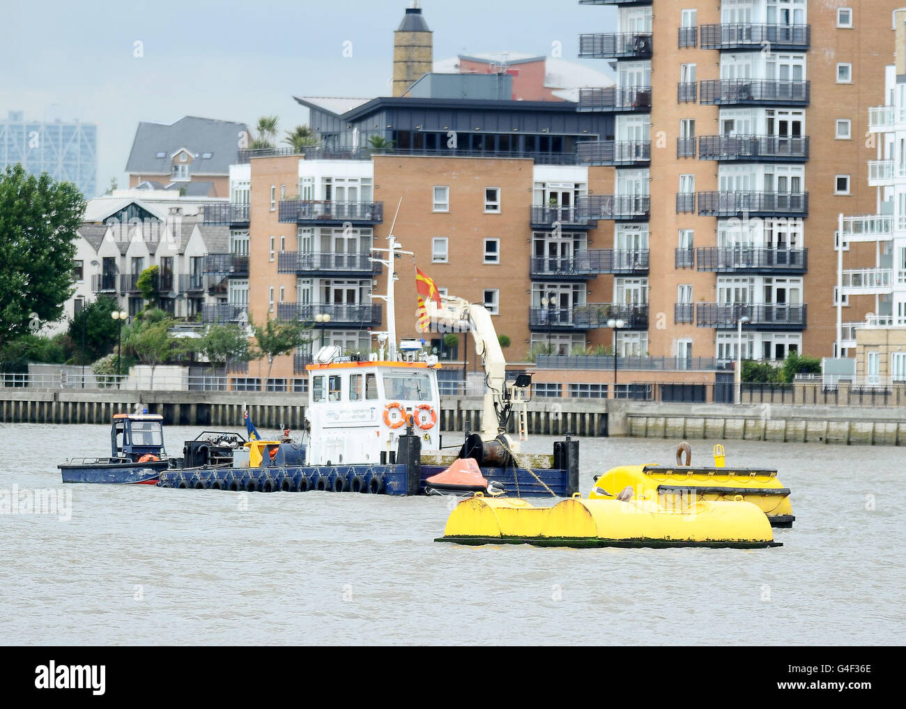 A crane and life raft sit above a tug which sank this morning on the ...