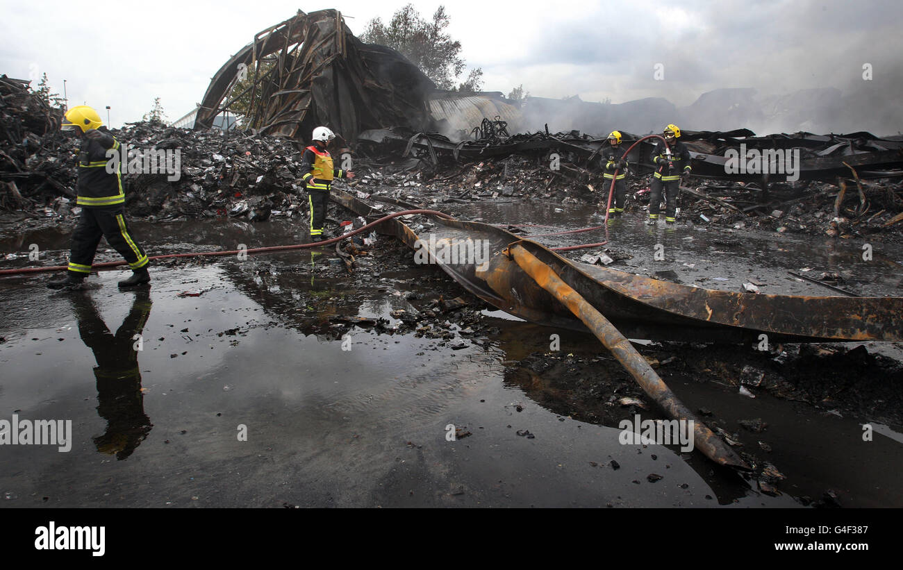 Firefighters working at the Sony Distribution Centre in Enfield North ...