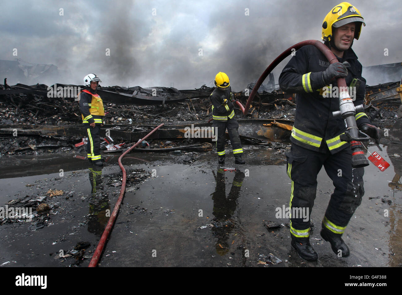 Firefighters working at the Sony Distribution Centre in Enfield North ...