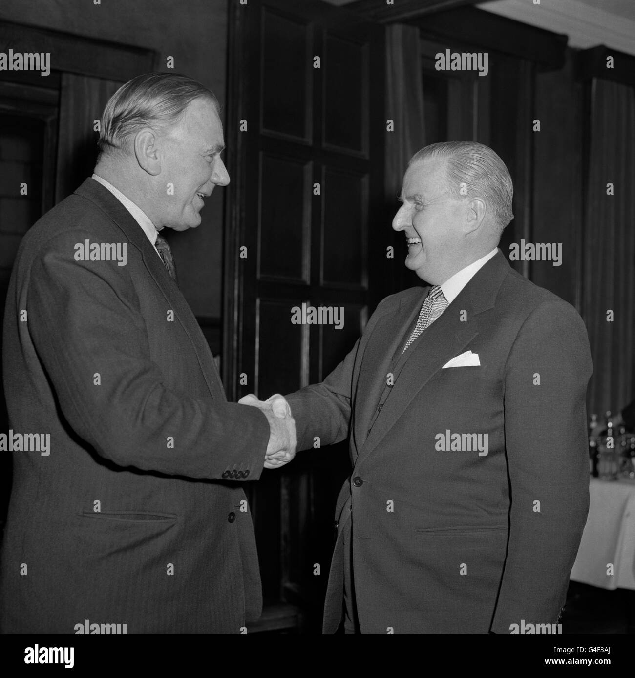 Mr Leslie McDonald (r) shakes hands with Val Parnell (l), the man he is ...
