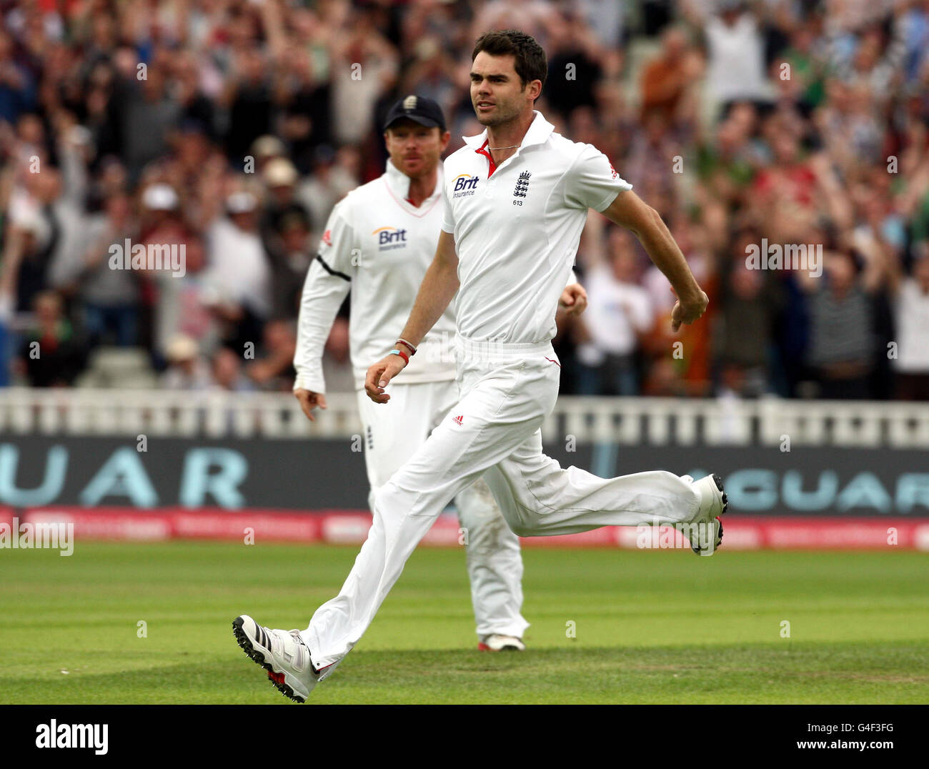 England's Jimmy Anderson runs to his teammates after he bowled India's ...