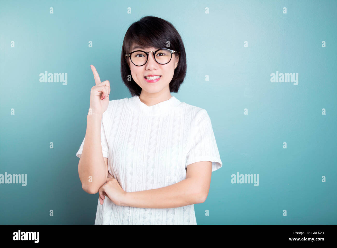 Young asian women thinking on blue background Stock Photo - Alamy