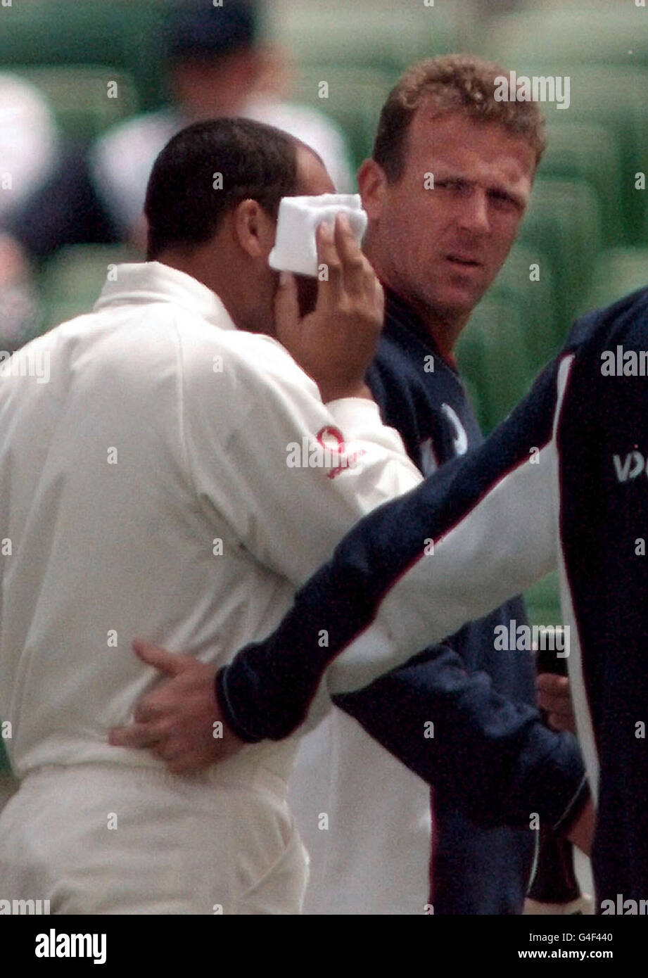 England captain Alec Stewart helps his brother-in-law Mark Butcher off ...