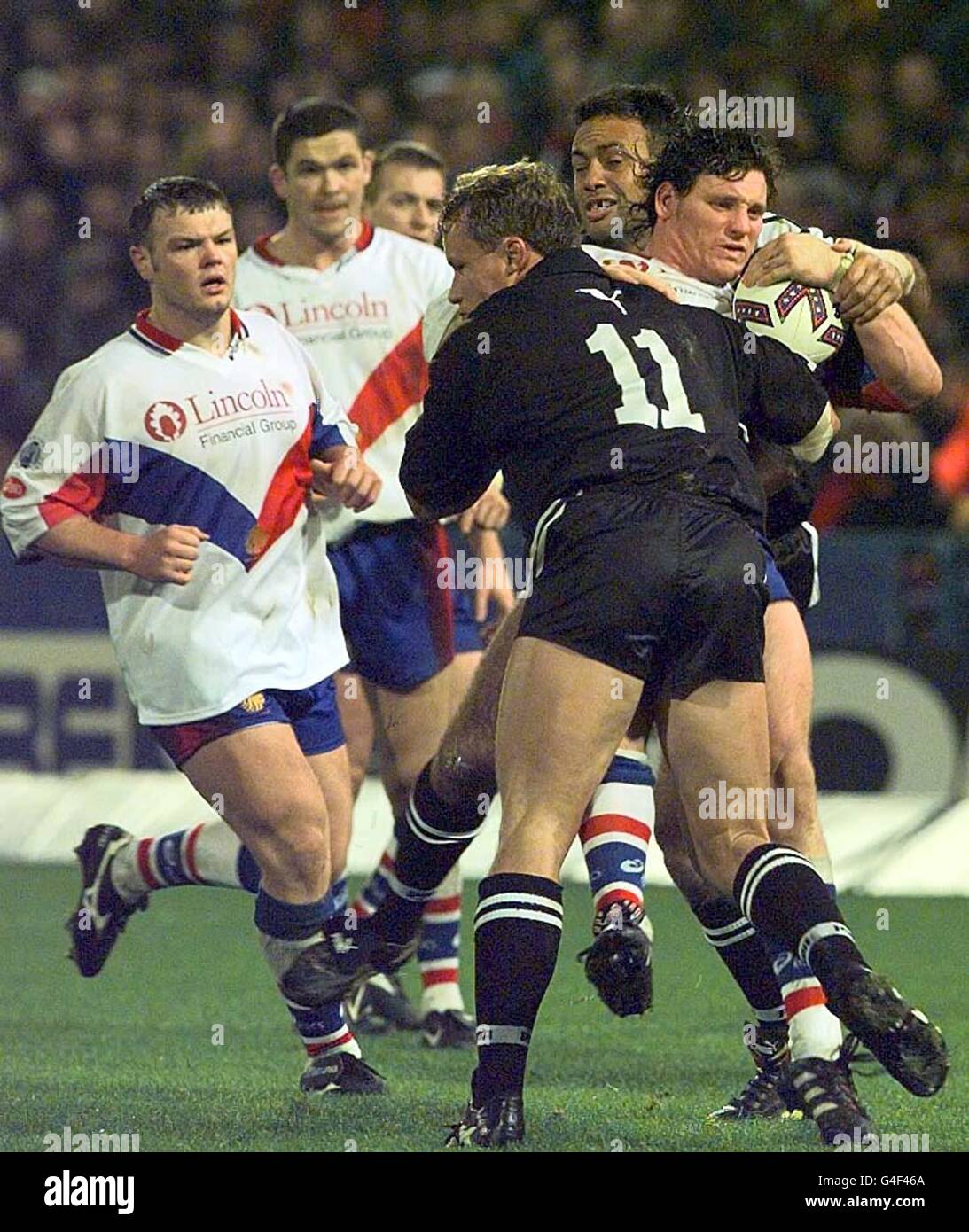Dale Laughton of the Great Britain Rugby League Team is tackled by ...