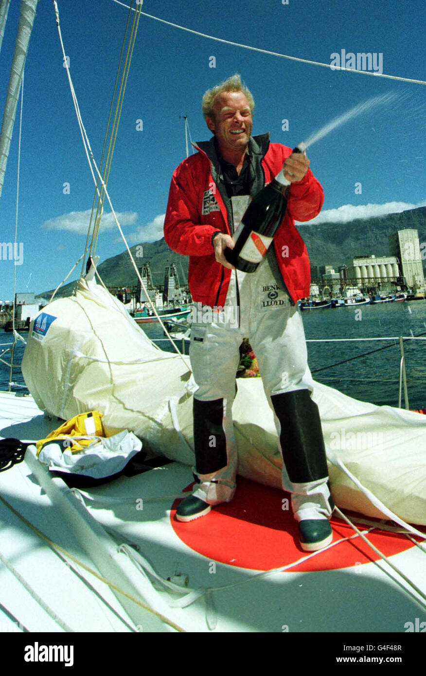 Team Group 4, skipper Mike Golding celebrates with champagne after ...