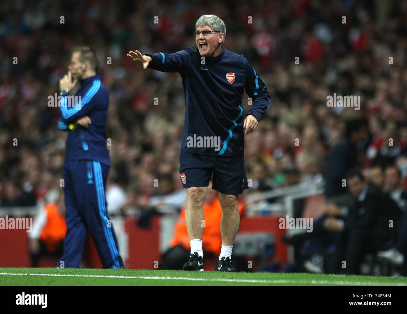 Arsenal assistant manager Pat Rice directs the players from the ...
