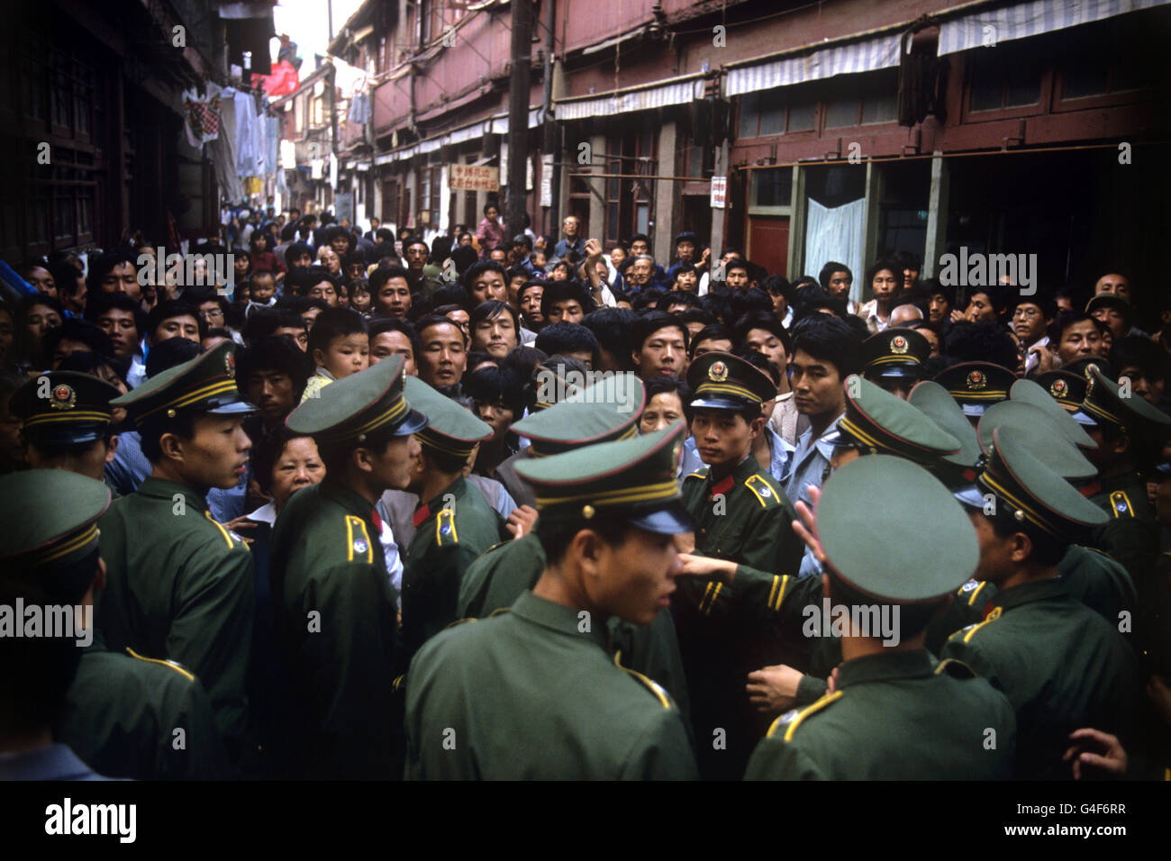 Police clearing the narrow streets of Old Shanghai in readiness for the ...