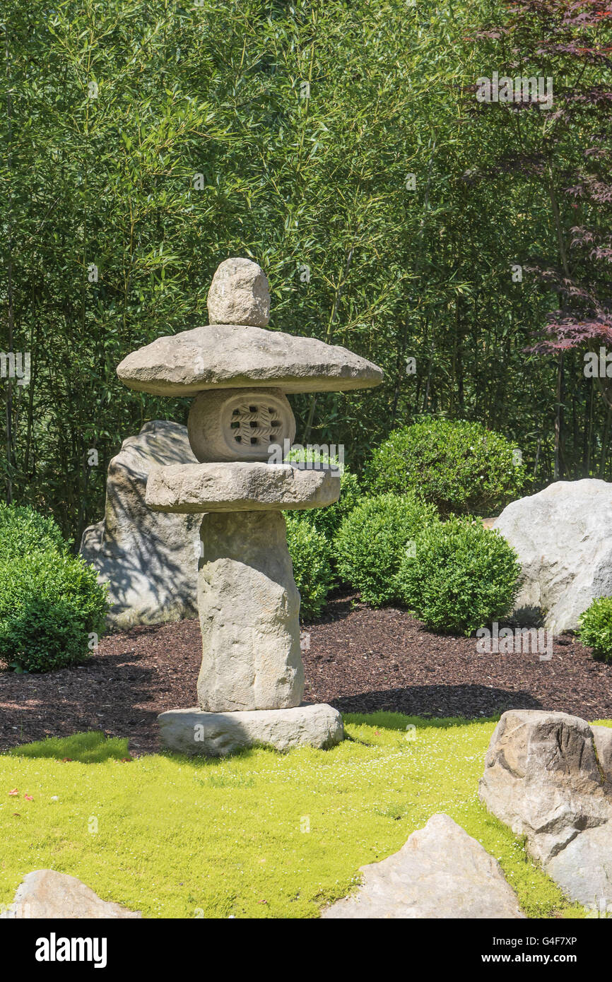 Japanese stone lamp in the Japanese garden. Vertically Stock Photo - Alamy