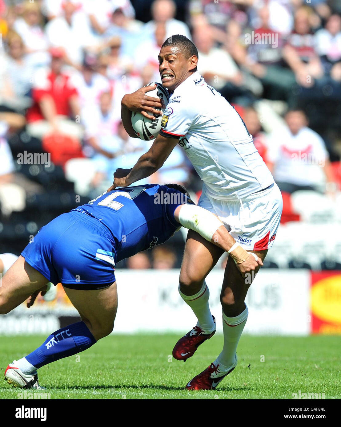 St Helens Leon Pryce is tackled by Hull KR's Ben Gates (left) during ...