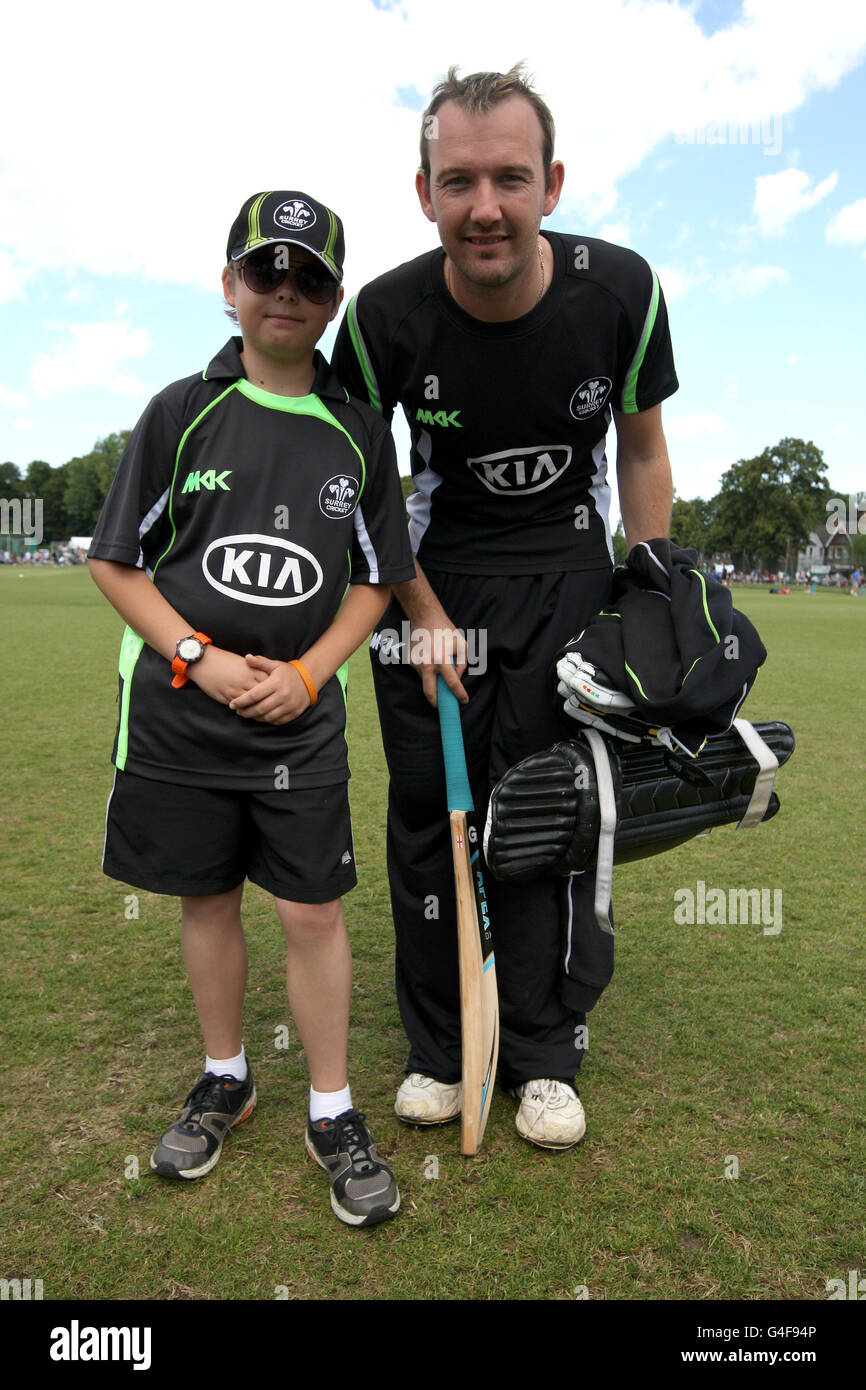 Surrey's Chris Schofield poses with the matchday mascot Stock Photo - Alamy