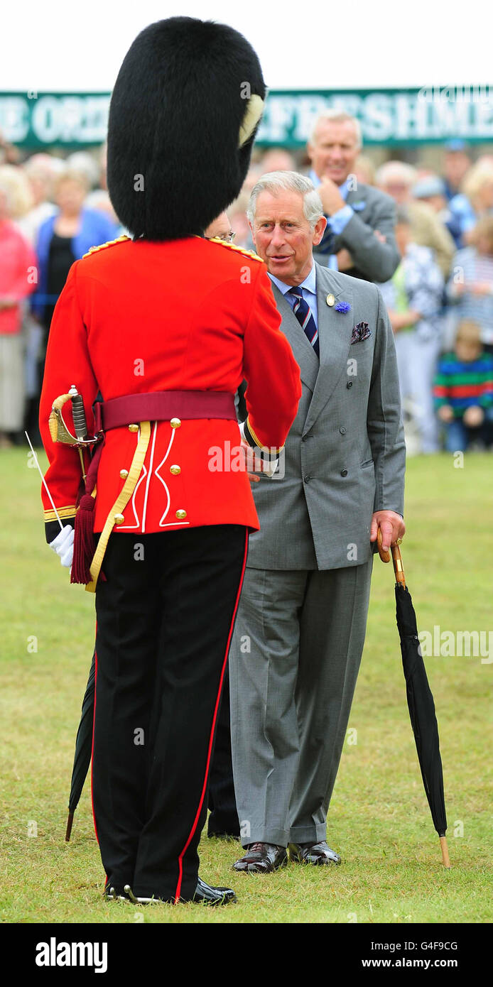 The Prince of Wales shakes hands with a soldier during a visit to the ...