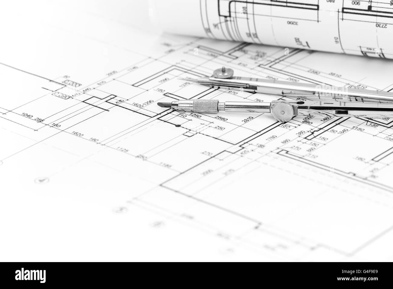 architectural background with plan, blueprint roll and drawing compass ...