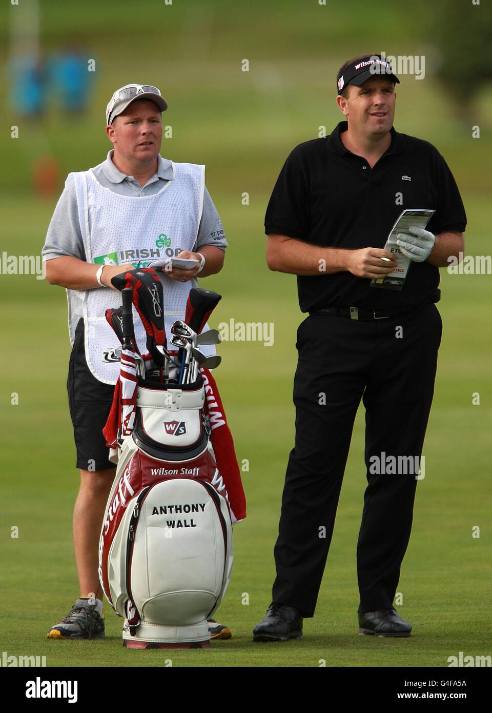 England's Anthony Wall (right) with his caddy during the second round ...