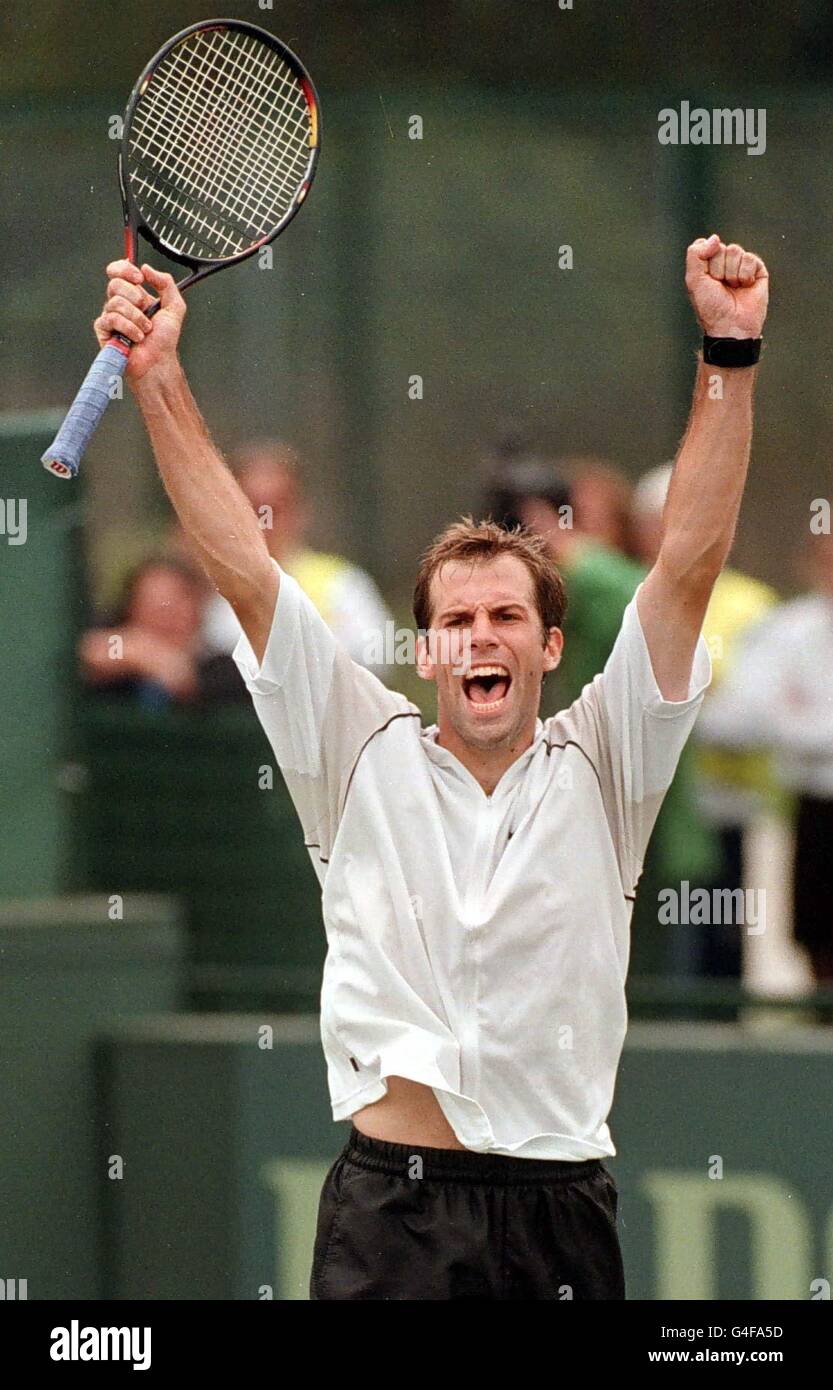 Greg Rusedski celebrates after beating Leander Paes during the Davis ...