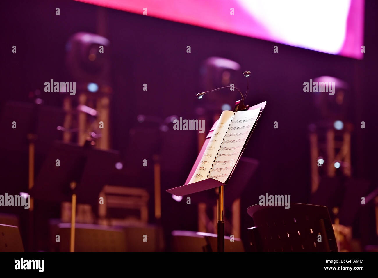 Music note stand with led lights during a concert Stock Photo - Alamy