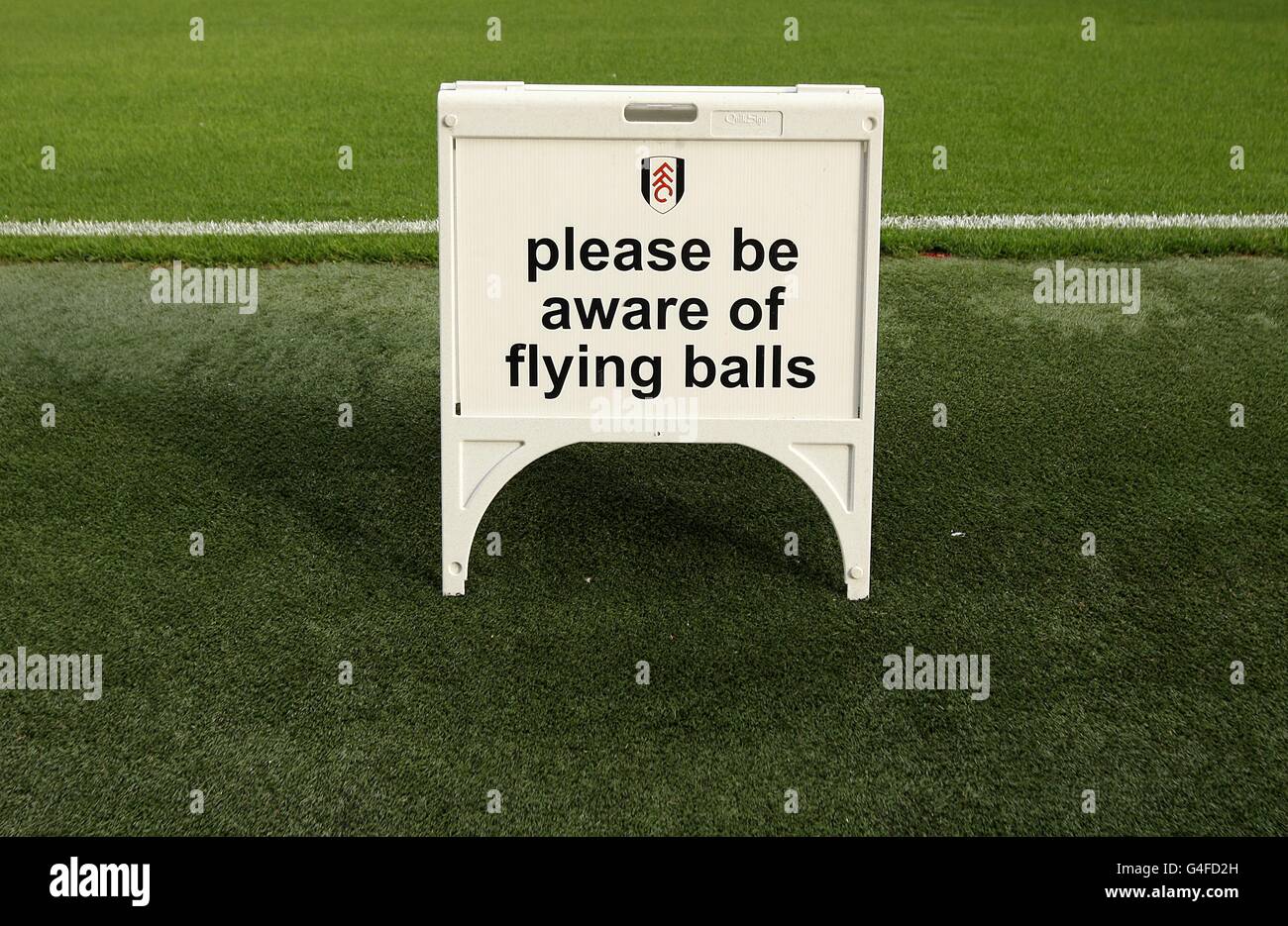 Please be aware of flying balls sign on the pitch hi-res stock ...
