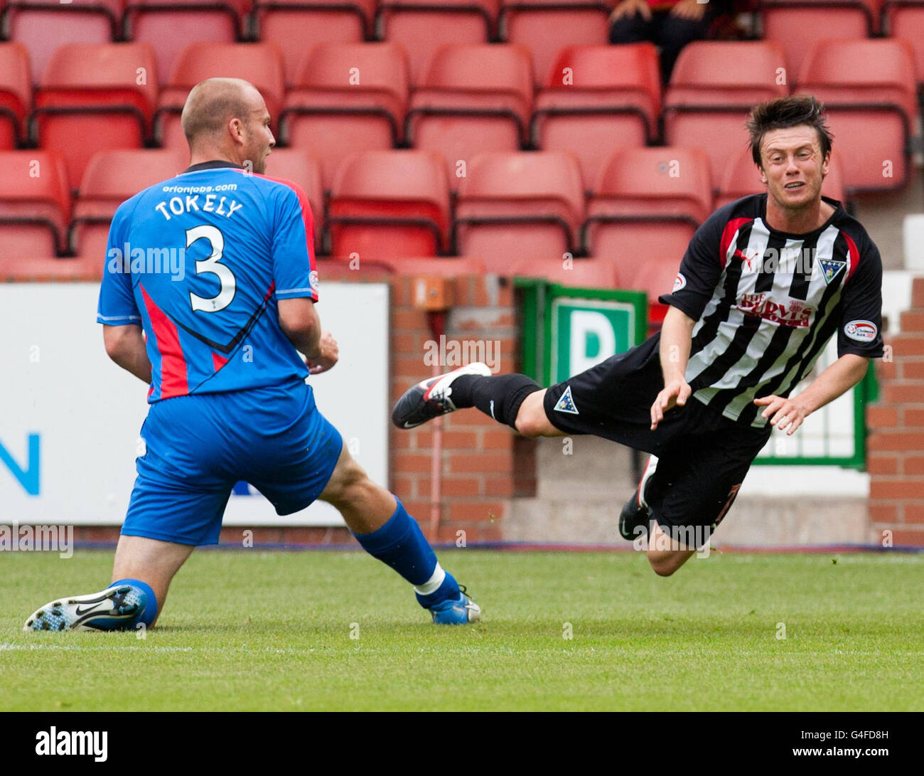 Inverness's Ross Tokely tackles Dunfermline's Joe Cardle (right) during ...