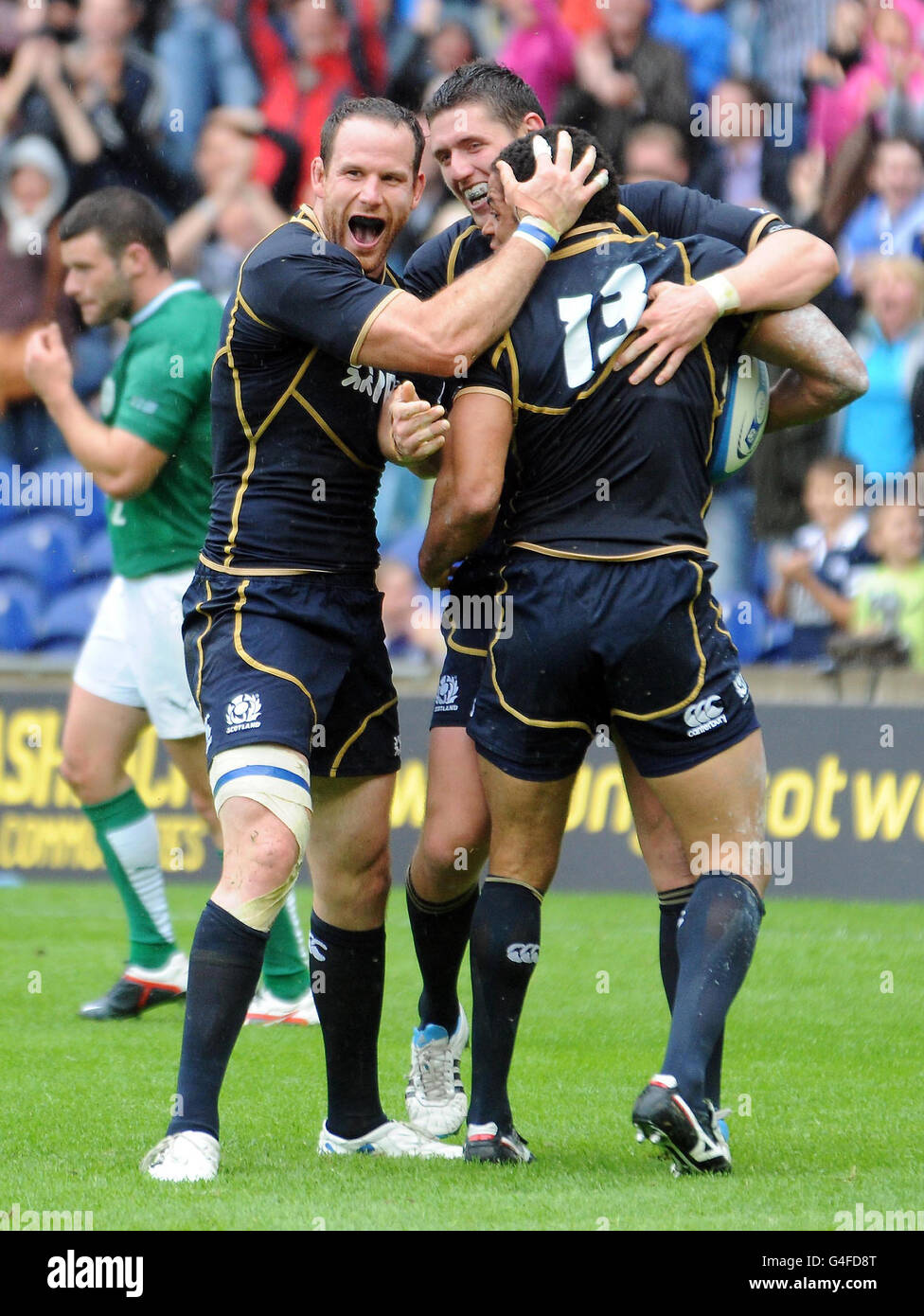 Scotland's Jo Ansbro (right) celebrates with team mates after scoring ...