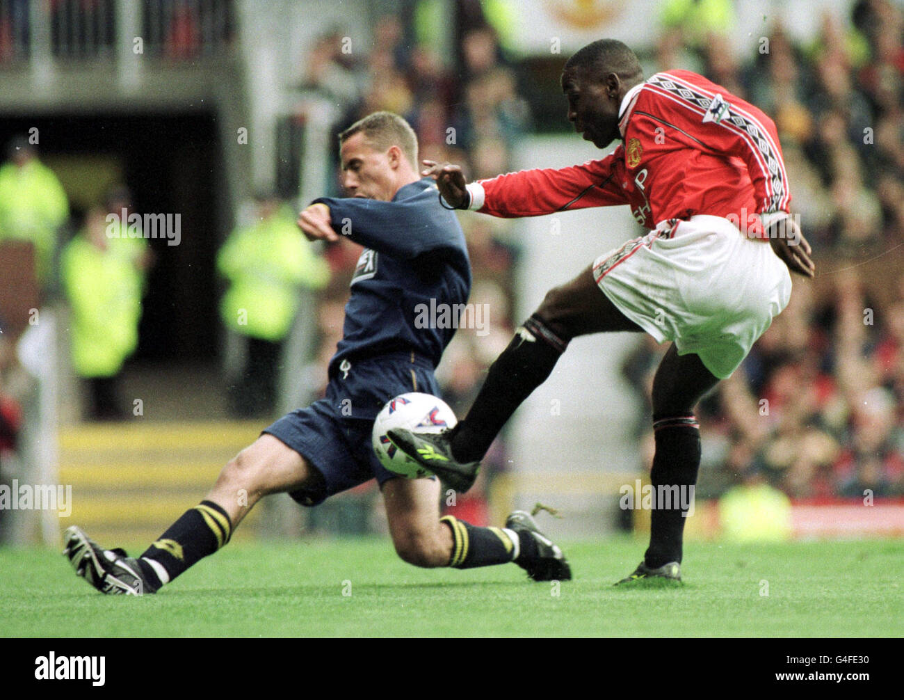 Wimbledon defender Chris Perry blocks an Manchester United's Andy Cole ...