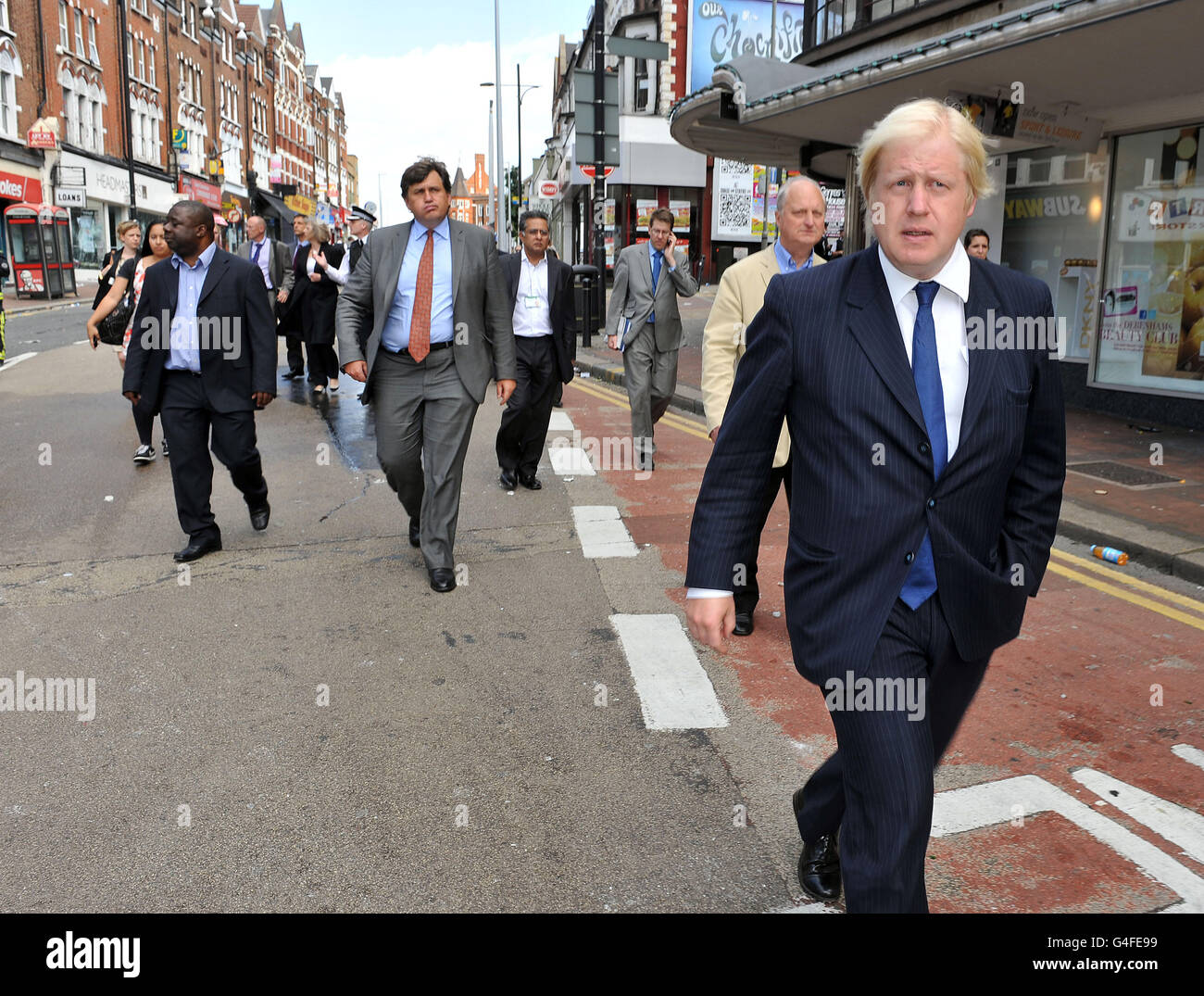 London Mayor Boris Johnson (right), followed by Kit Malthouse of the ...