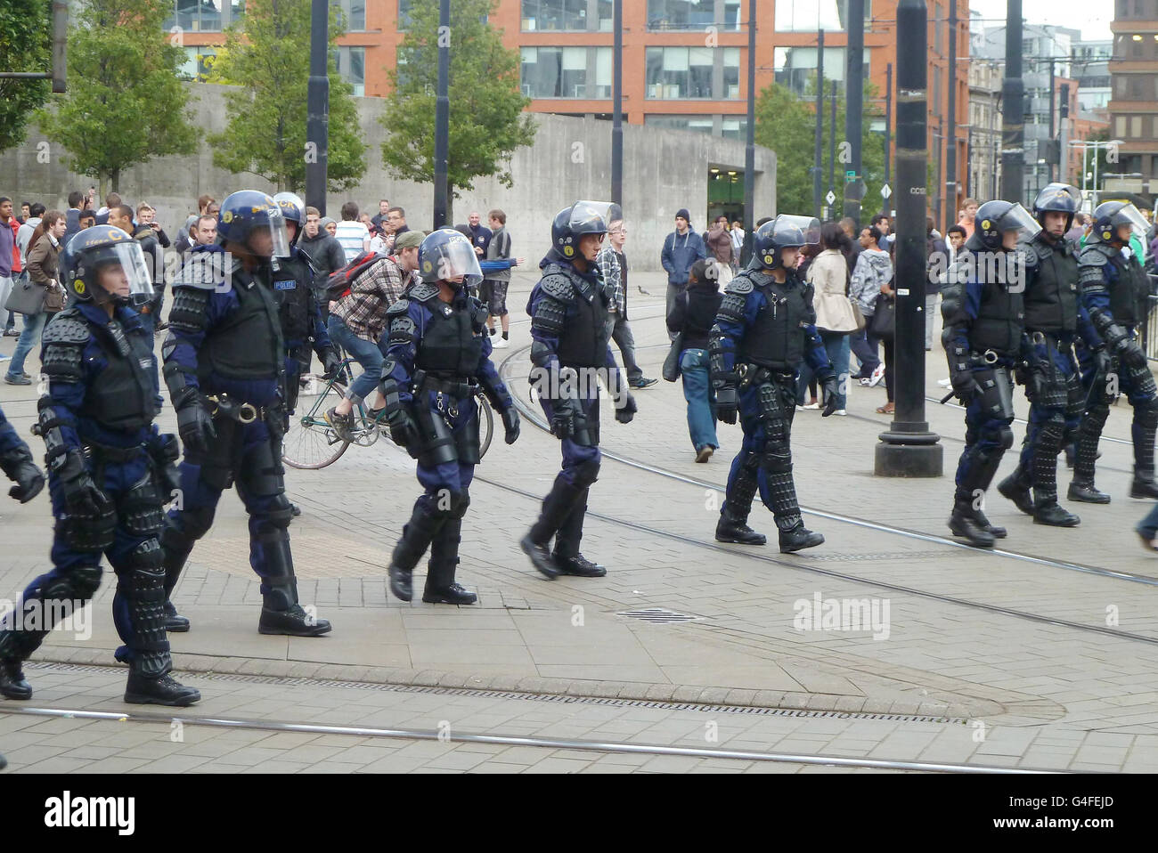Riot police patrol Manchester city centre after trouble on Market ...