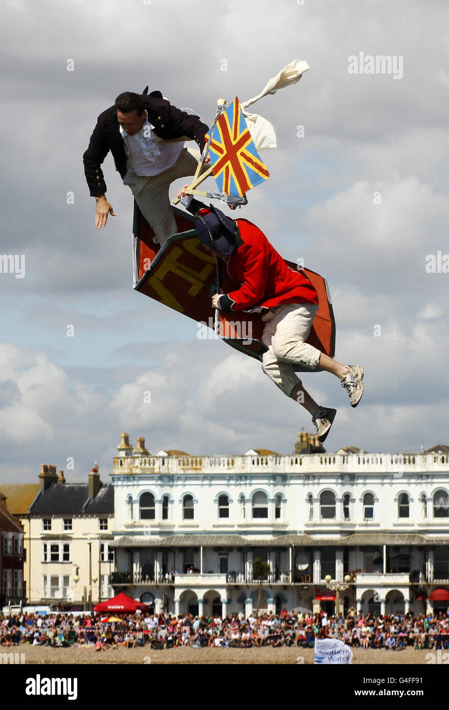 Richard and michael folsom leap off worthing pier in worthing hi-res ...