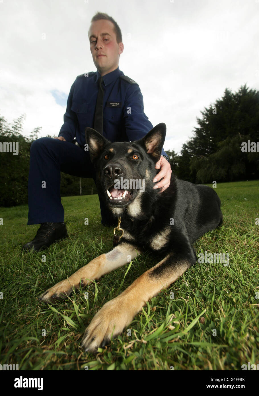 Constable Phil Wells of the Metropolitan Police Dog Support Unit with ...