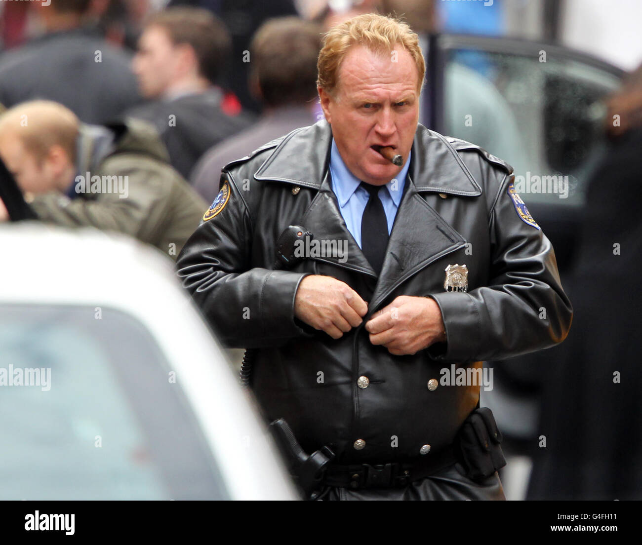 A policeman character on set durng the filming of World War Z near ...