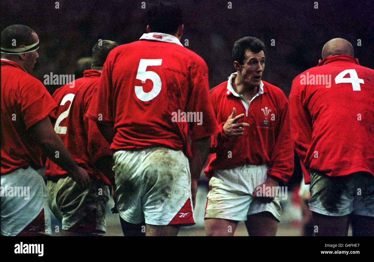 Rob Howley captain of the Welsh team talks to his forwards in the match ...