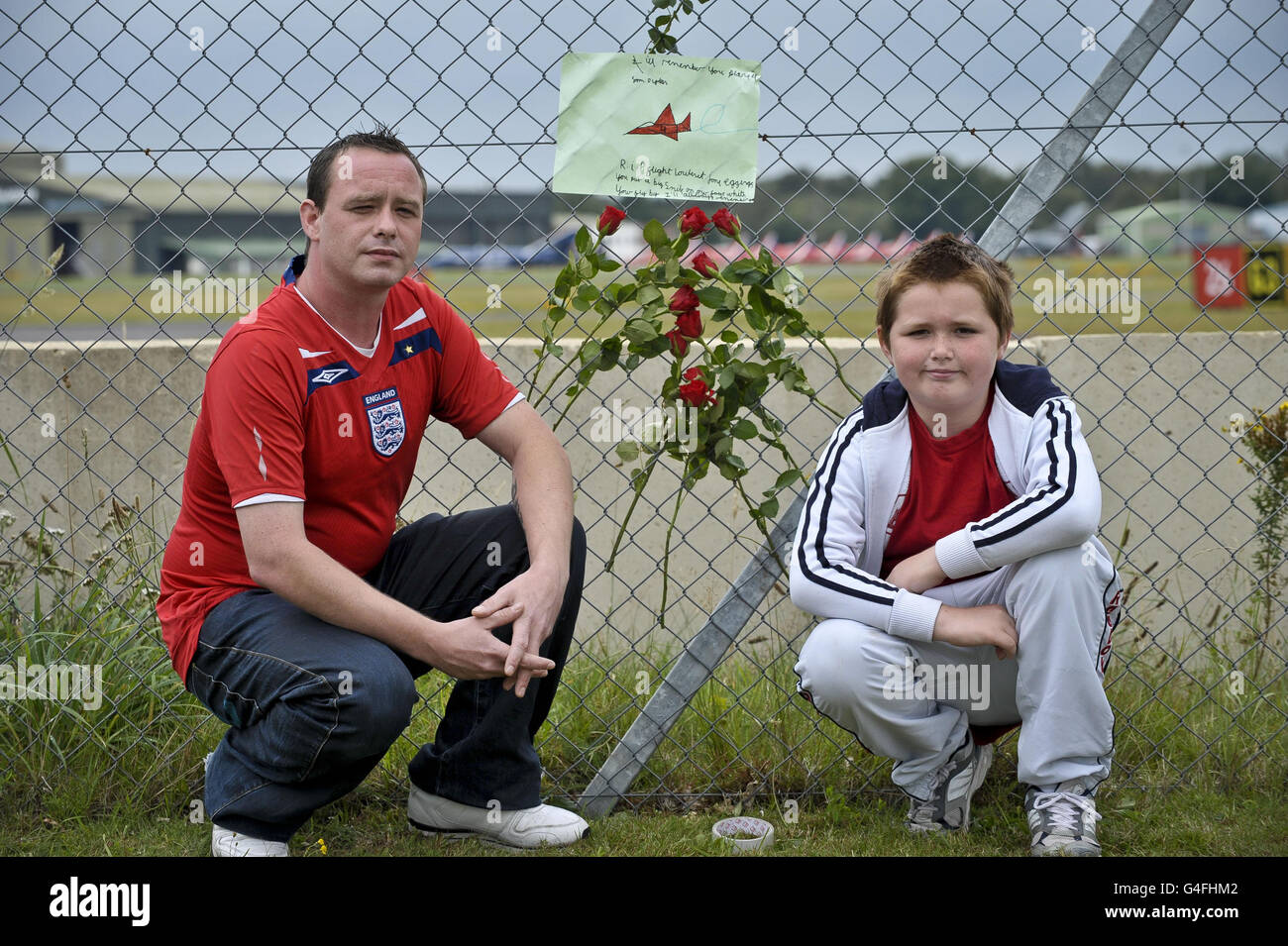 Dylan Blakeman 9 and father Ian from Southampton, place red roses and a ...