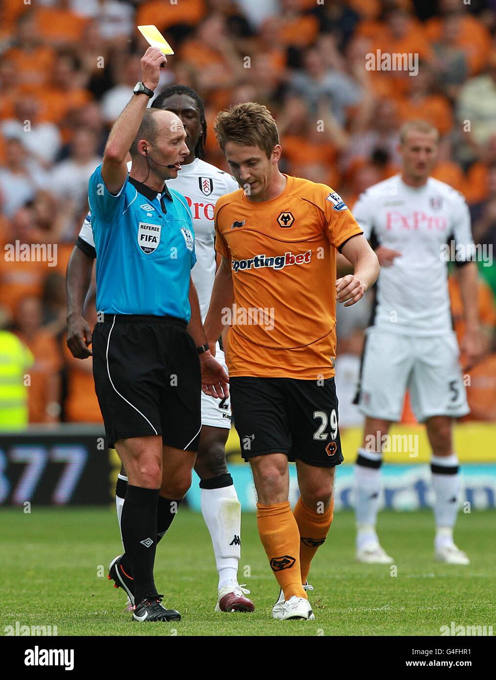 Wolverhampton Wanderers' Kevin Doyle is shown the yellow card by ...