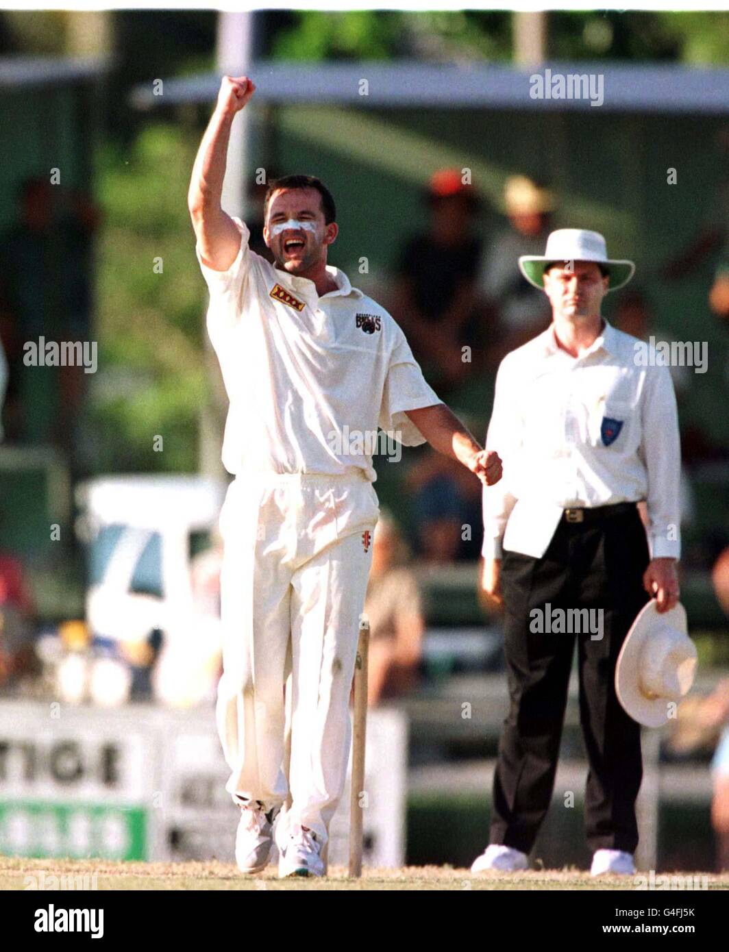 Queensland bowler Adam Dale celebrates the wicket of Dominic Cork, out ...