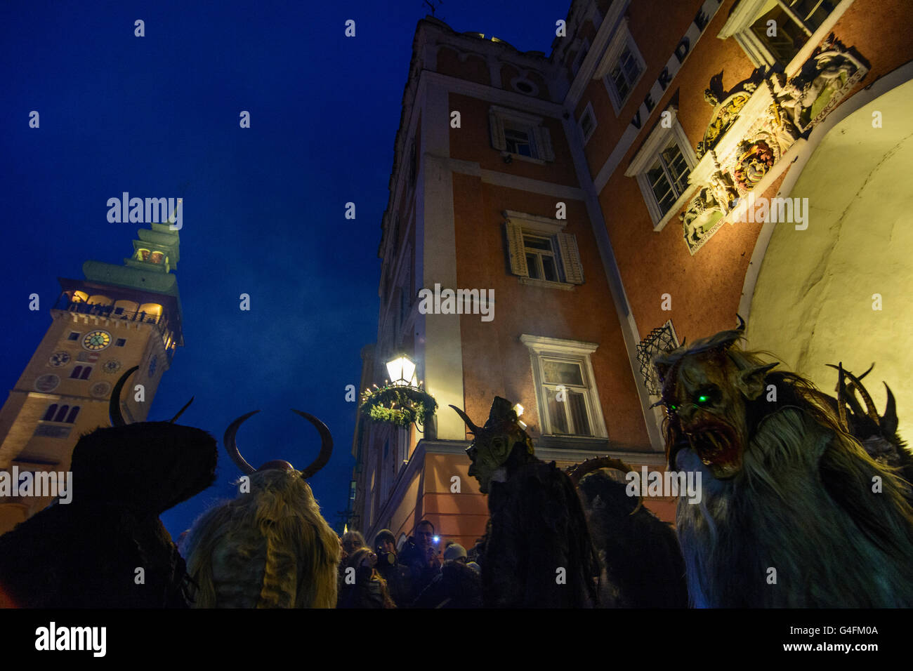 mask procession Perchtenlauf with Krampus at square Hauptplatz, house ...