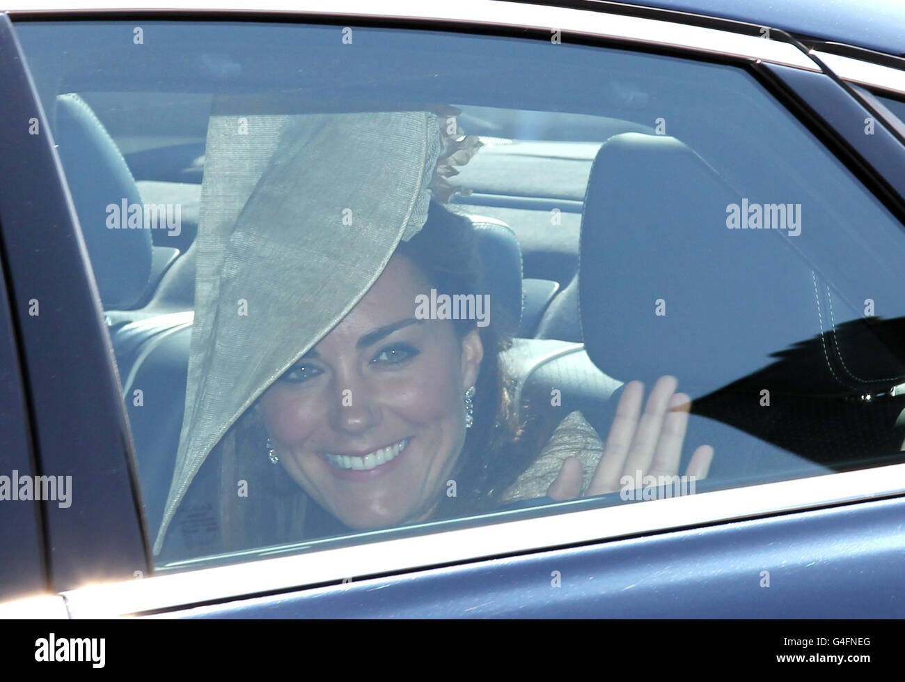 The Duchess of Cambridge waves in a car on the Royal Mile after the ...