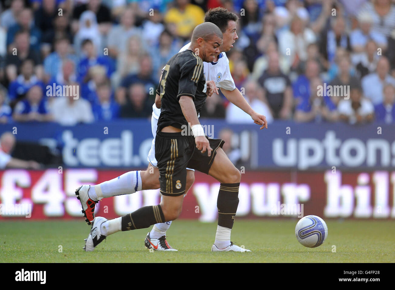 Leicester City's Sean St Ledger and Real Madrid's Pepe (front) battle ...