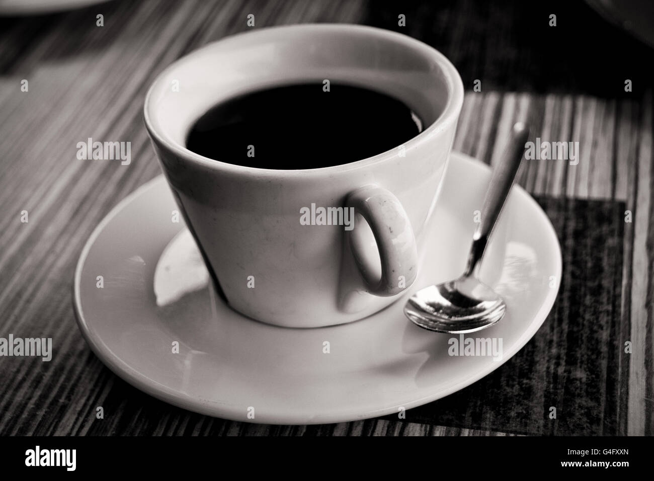 Time for a break. A cup of black coffee resting on a table at a local ...