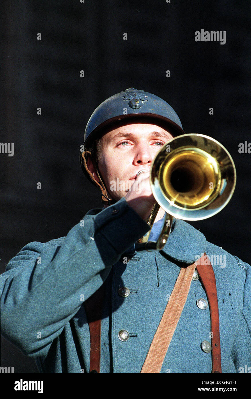 A French soldier plays the bugle at the Arc de Triomphe this morning ...