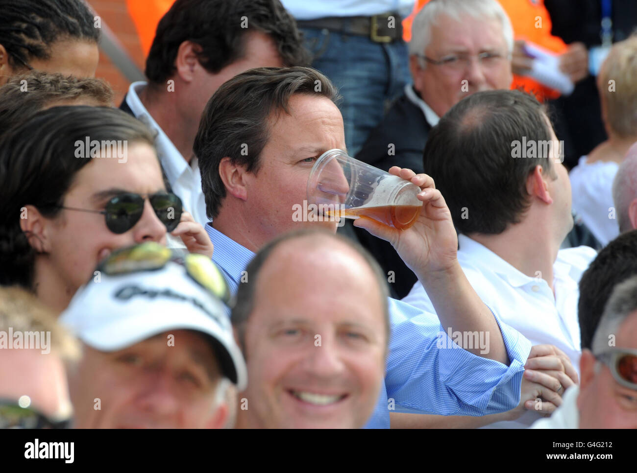 Prime Minister David Cameron drinks a pint during the npower Fourth ...
