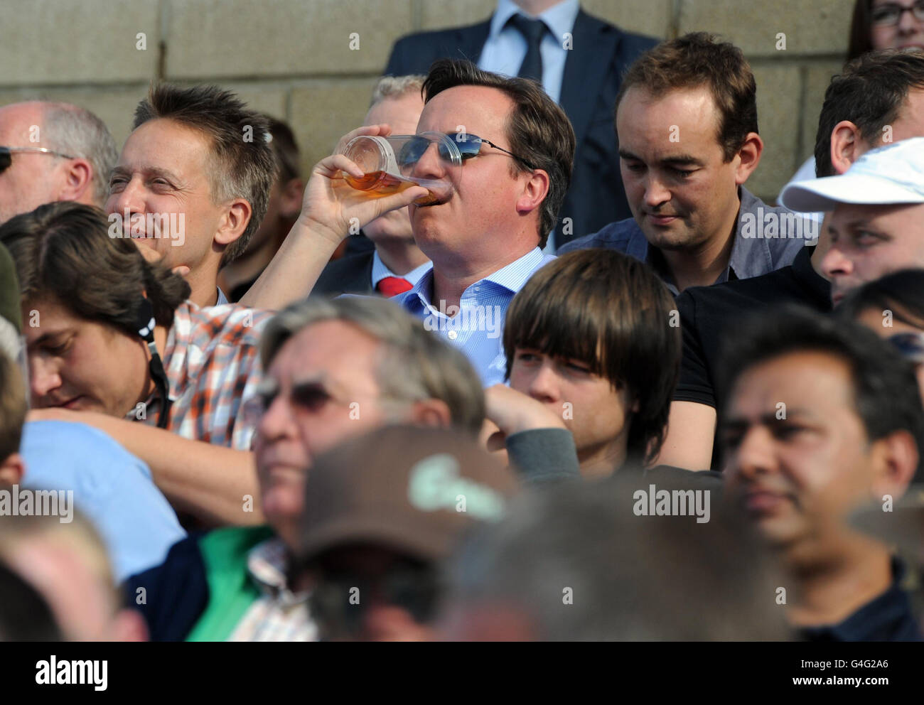 Prime Minister David Cameron drinks a pint during the npower Fourth ...