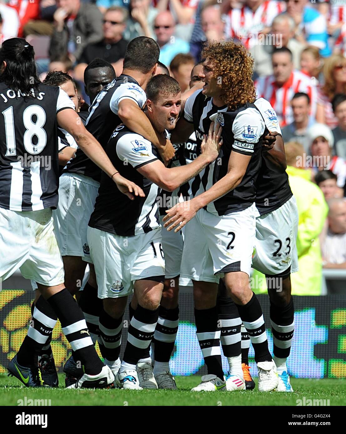 Newcastle United's Ryan Taylor (centre) is mobbed by his team mates ...