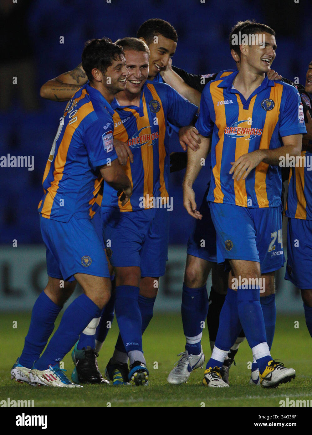 Shrewsbury Town's Nicky Wroe (second left) celebrates the third goal ...