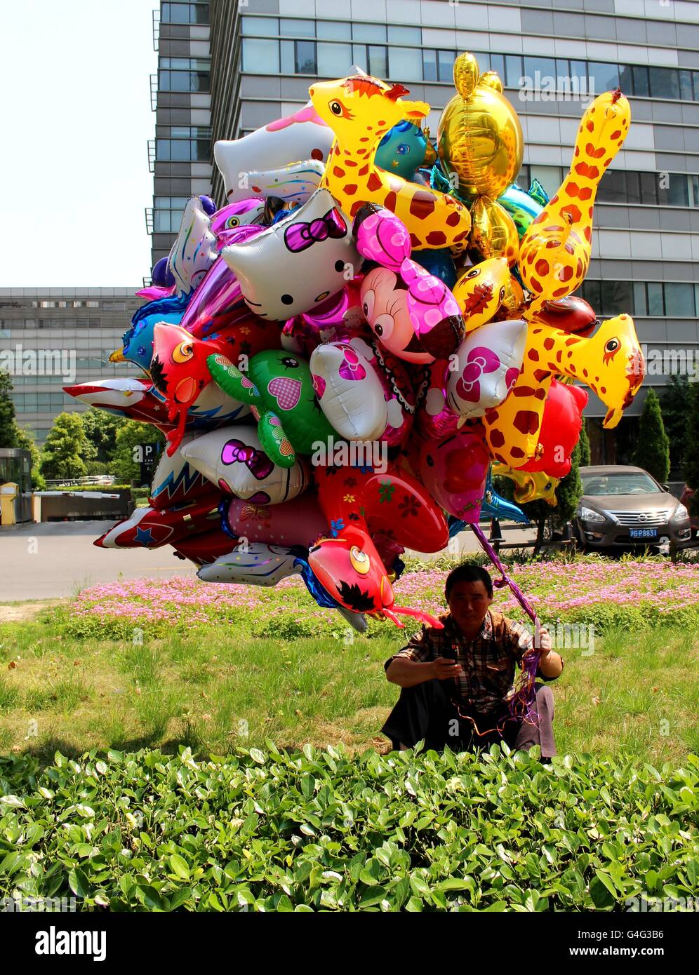 A local touting balloons in Shanghai, China Stock Photo - Alamy