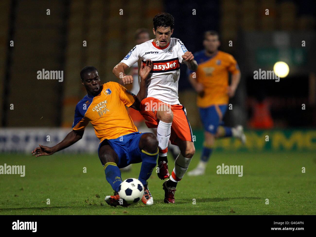 Mansfield Town's Anthony Howell and Luton Town's James Dance (right ...