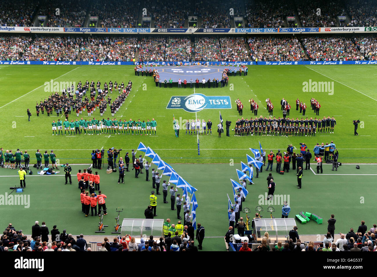 The Scotland and Ireland players line up for the Nation al Anthem as a ...